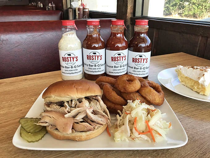 That pulled turkey sandwich looks mighty fine next to those onion rings, with house-made sauces standing at attention like soldiers.