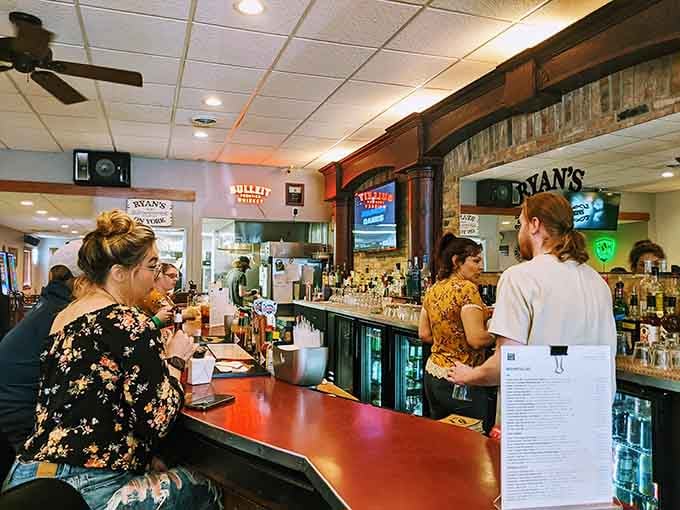 The bar beckons with friendly faces and cold drinks, making every visit feel like coming home.