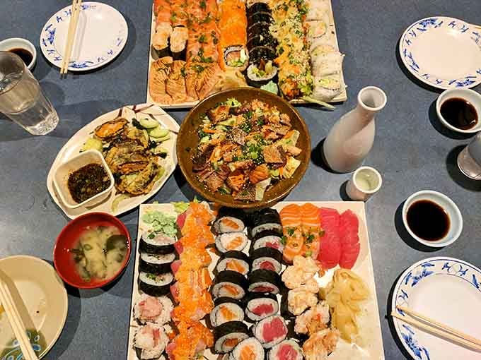 Vibrant platters filled with a colorful variety of artfully rolled and sliced delicacies create a stunning and inviting table spread.