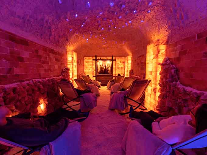 Visitors recline in peaceful bliss, breathing in microscopic salt particles while the outside world fades to background noise.