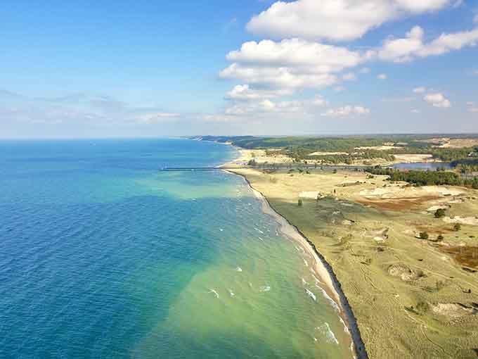 Oval Beach stretches endlessly along Lake Michigan, proving that freshwater can absolutely compete with any ocean you've ever seen.