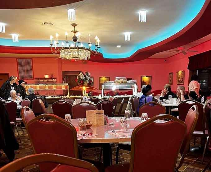 Diners enjoying their meals under those magnificent chandeliers, creating memories one pierogi at a time in this timeless space.