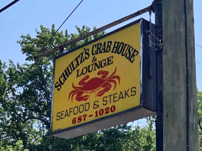 That yellow sign promises exactly what's inside: honest seafood, cold drinks, and zero pretension from start to finish.