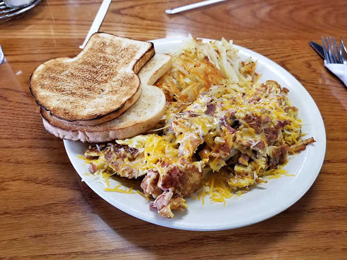 Breakfast done right: eggs, hash browns, and toast ready to fuel your entire day ahead.
