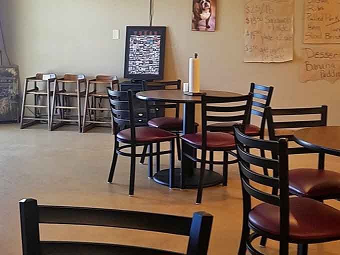 Rustic barn doors and decorative trees create an atmosphere that's part mountain lodge, part barbecue paradise, entirely welcoming to hungry souls.