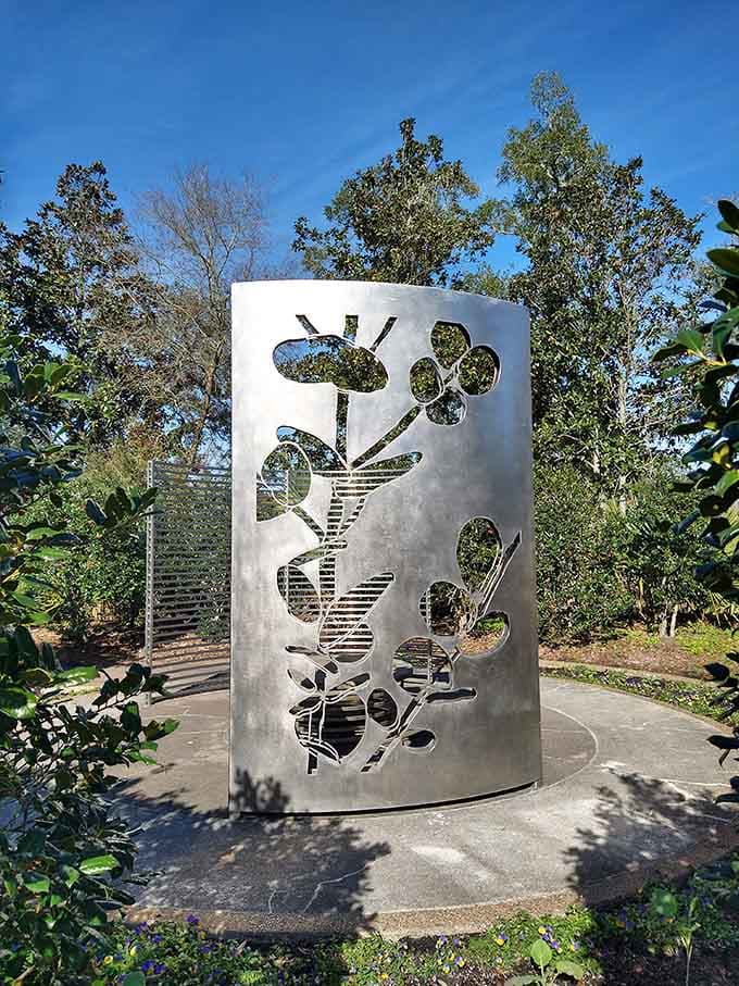 This metallic sculpture proves that art and nature can coexist beautifully without either one stealing the show from the other.