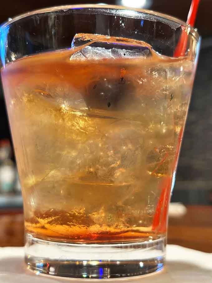 An old fashioned done right, with that perfect amber glow that promises a smooth, classic cocktail experience ahead.