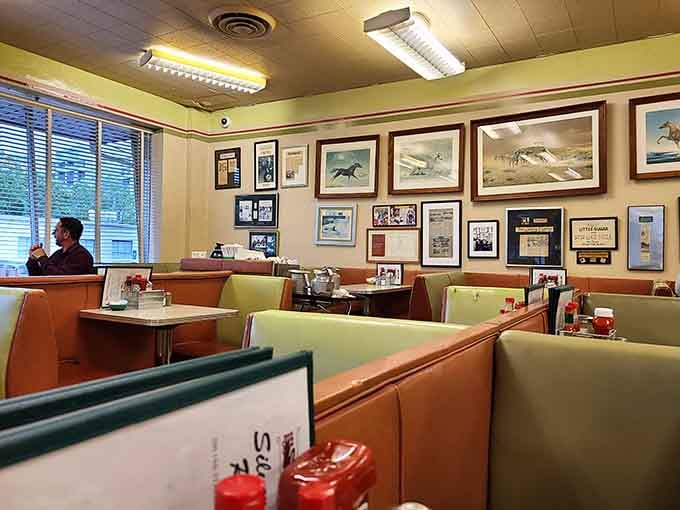 Another angle of diner perfection, where framed memories line walls and comfort lives in every corner.