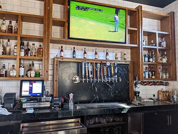 The bar area features craft taps and a TV, balancing sports-watching needs with serious drinking ambitions perfectly.