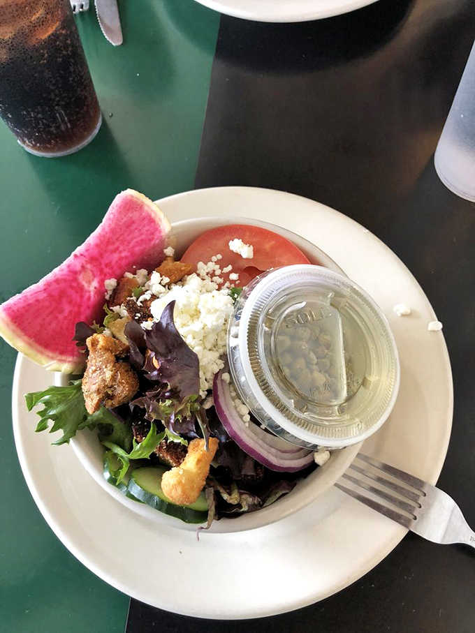 A fresh salad with watermelon proves this diner knows you can't live on ice cream alone, though you'd try.