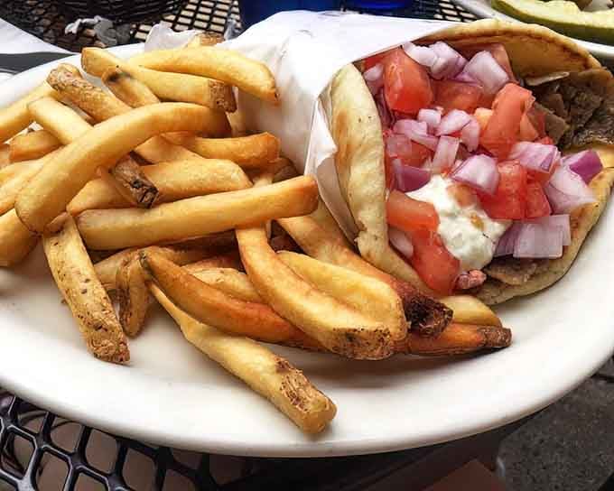 A gyro wrapped with care and served with fries, because sometimes lunch needs to feel like vacation.