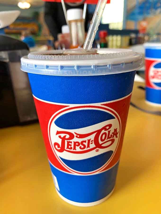 That retro Pepsi cup is pure nostalgia, though honestly you're here for what's in the bowl, not the beverage.