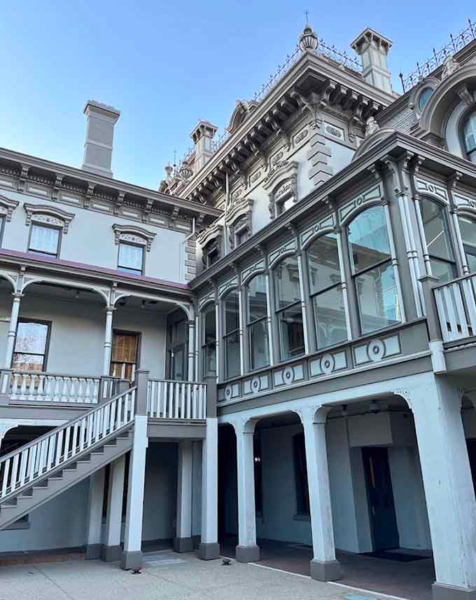 The interior courtyard and balconies reveal hidden architectural gems you'd miss from the street level entirely.