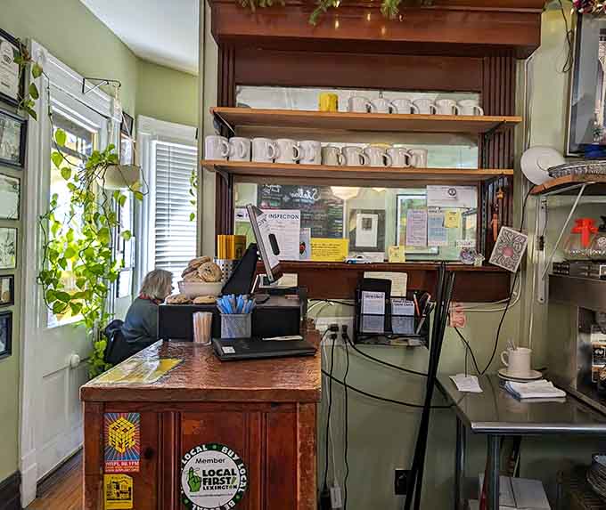 The order counter maintains that homey feel with shelves of mugs and a cash register that looks ready for business.