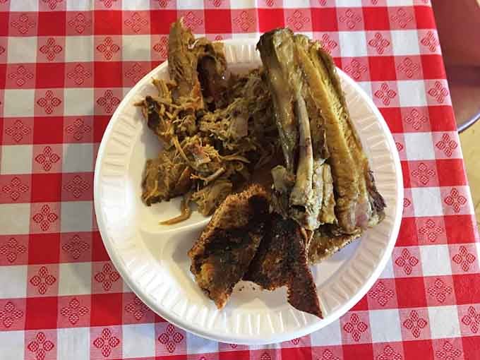 This is what whole-hog barbecue looks like before it meets your plate, a beautiful study in smoke and patience.