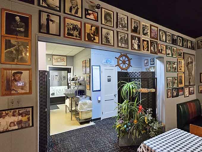 Even the hallway to the restrooms is lined with family photos, because every inch of this place celebrates connection.