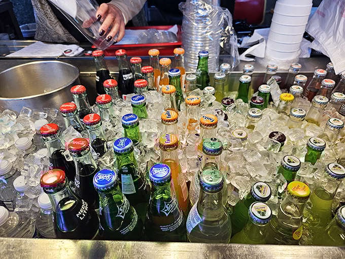 An ice bath full of Mexican sodas in glass bottles, because authentic details matter in every single way.
