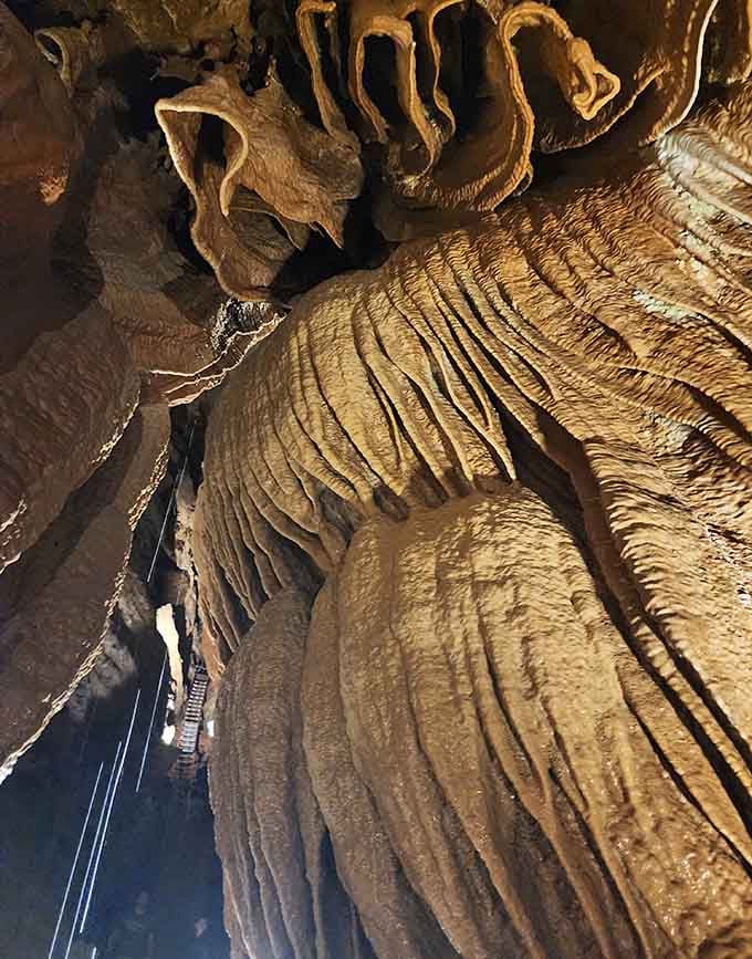 Flowstone cascades frozen mid-pour, creating sculptures that would make Michelangelo throw down his chisel in defeat.