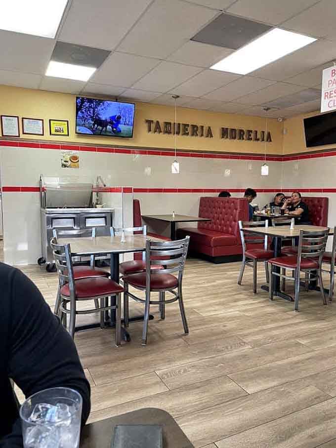 The "Taqueria Morelia" sign on the wall reminds you where you are, just in case the amazing food made you forget.