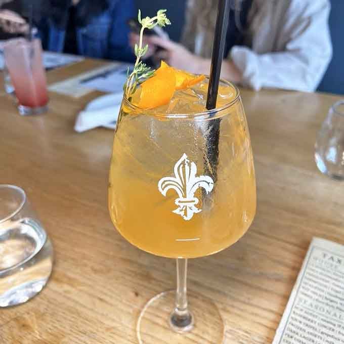 This spritz looks like sunshine in a glass, complete with herbs that make it Instagram-worthy and delicious simultaneously.