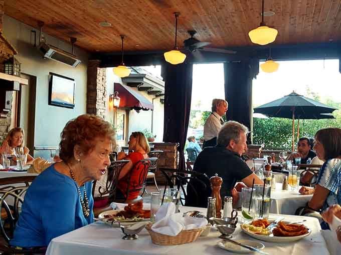 Real people enjoying real meals in a real restaurant, no phones in sight, just good old-fashioned dining pleasure.