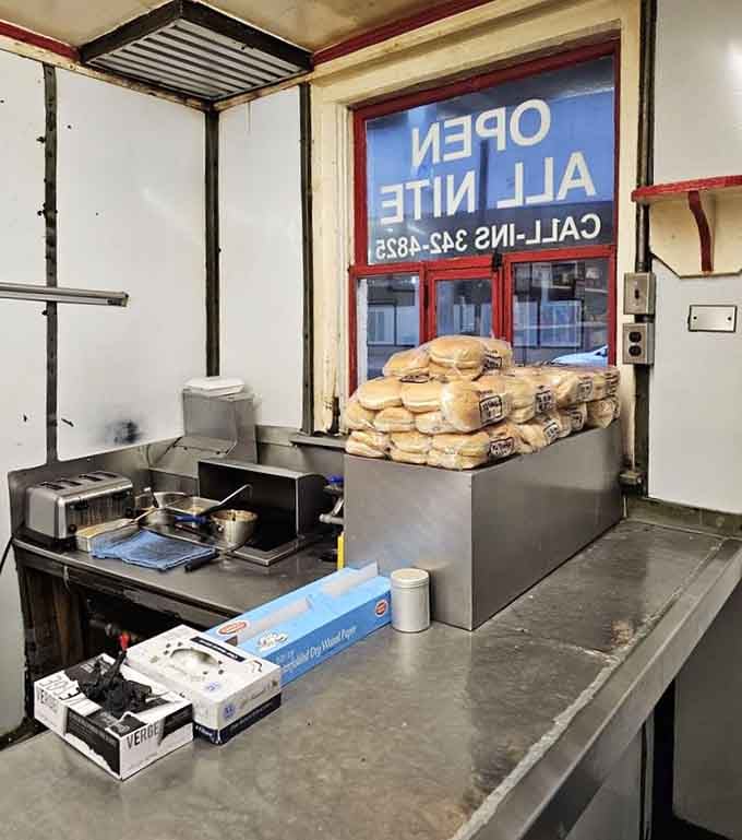 The kitchen where magic happens in a space smaller than most people's closets, efficiency at its finest.