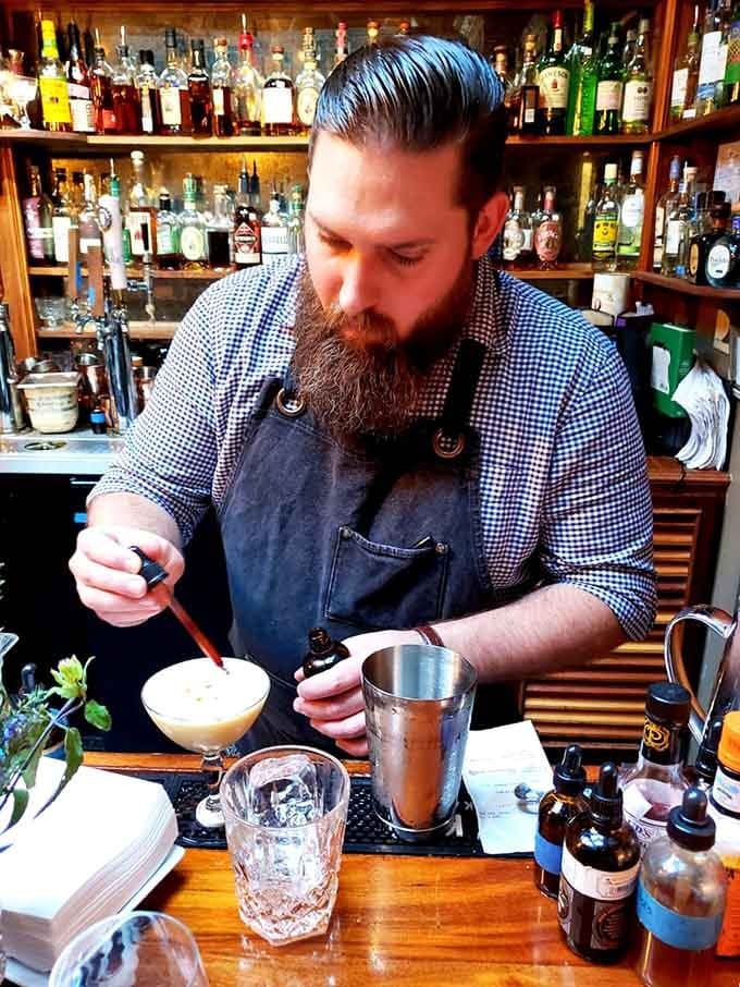 Watch a true craftsman at work, mixing drinks with the precision of a chemist and the soul of an artist.