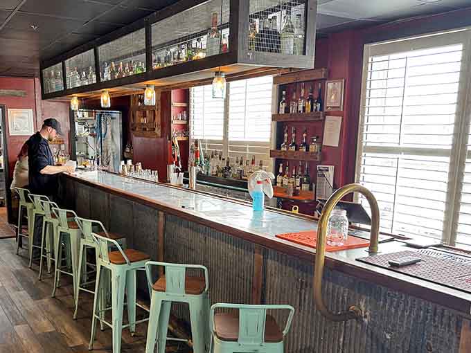 Rustic charm meets refreshment: A cozy neighborhood bar where mint-green stools invite you to stay awhile.