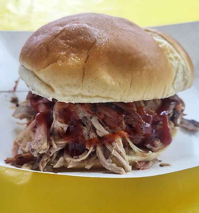 That pulled pork sandwich stacked impossibly high on a soft bun is Kentucky BBQ at its finger-licking, napkin-requiring finest.