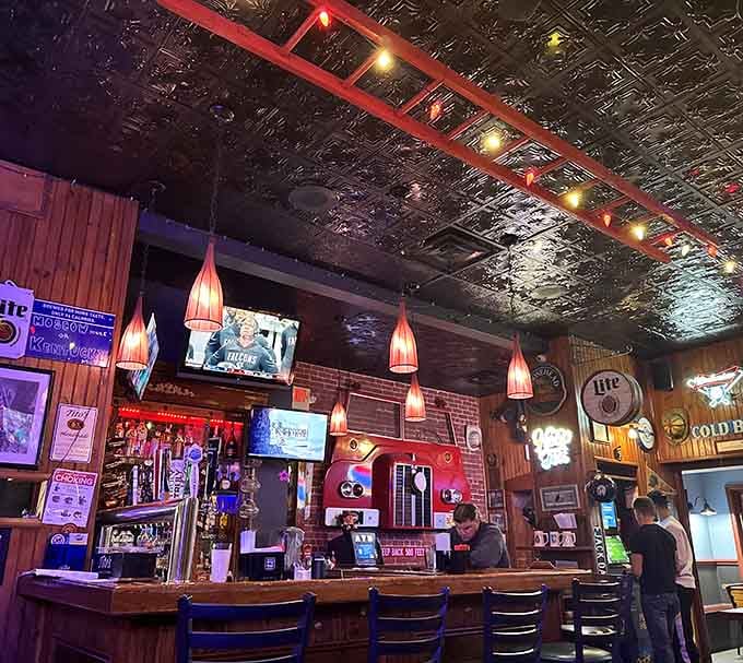 The bar gleams with taps, bottles, and that unmistakable neighborhood warmth where everybody eventually knows your usual order.