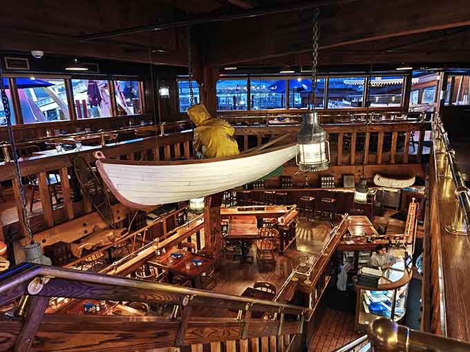 A decorative boat suspended from the ceiling proves someone had vision, budget, and excellent insurance coverage all at once.