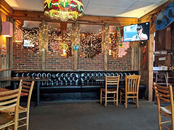 Twinkling lights and brick accents create intimate dining nooks where every meal feels like a special occasion worth celebrating.