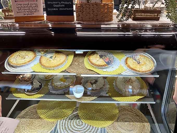 The pie display case showcases homemade beauties that make choosing just one flavor feel nearly impossible.