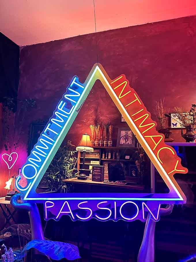 This neon triangle screams commitment, intimacy, and passion louder than any relationship advice column ever could, honestly.