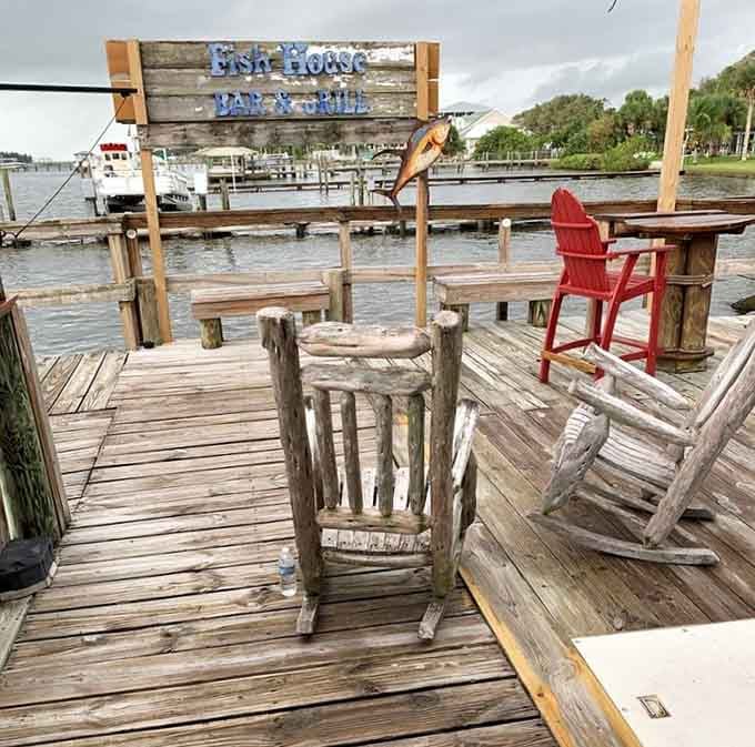 Weathered dock chairs facing the lagoon: your office for the afternoon, no conference calls allowed here.
