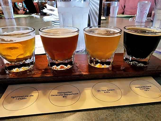 Four distinct brews lined up for tasting, from pale to dark, showcasing the tavern's incredible selection.