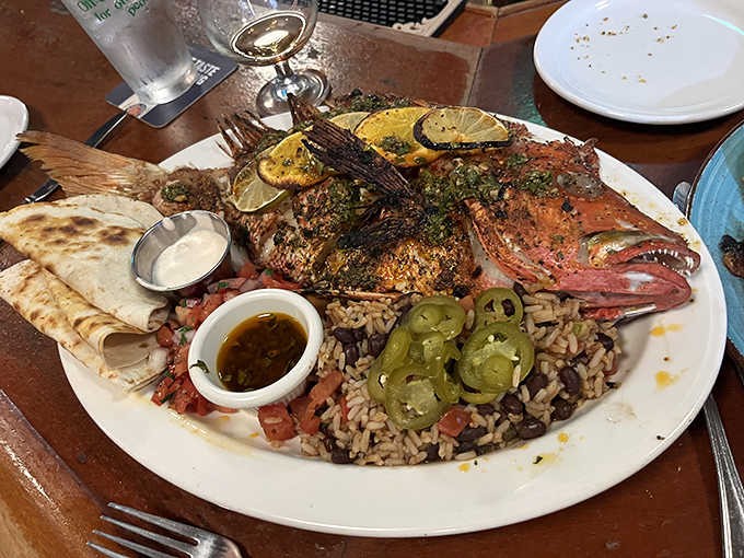 This whole grilled red snapper is the kind of dramatic presentation that makes everyone at nearby tables jealous.