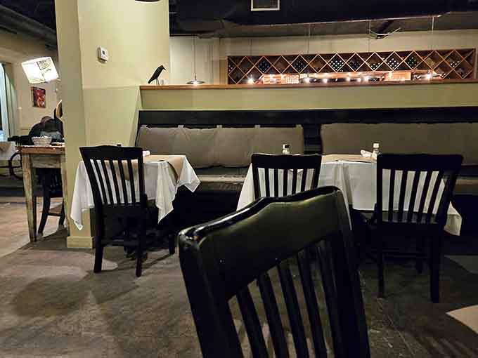 Intimate seating arrangements with crisp linens create cozy corners perfect for conversations that last longer than the meal itself.