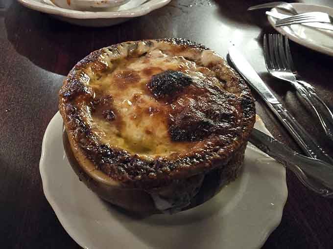 That bubbling, cheese-topped French onion soup is comfort in a crock, the kind that warms you from the inside out completely.