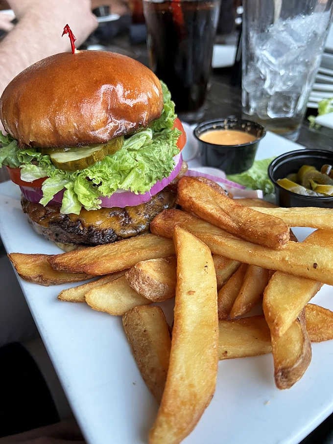 This burger stands tall and proud, stacked with everything good in life between two perfectly toasted buns.