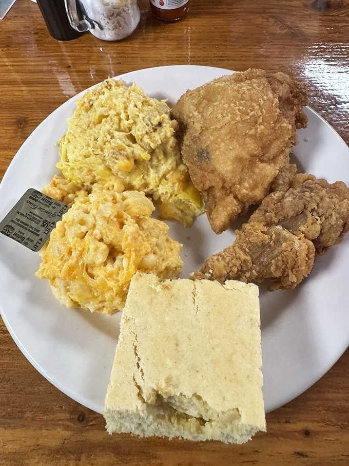 Fried chicken with mac and cheese and cornbread satisfies those landlubbers who somehow skip the seafood options.