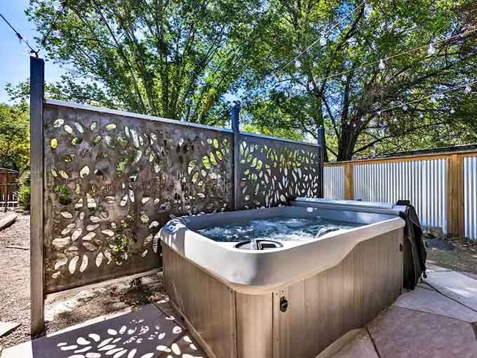 A hot tub waits outside because hobbits would absolutely have embraced modern relaxation technology.