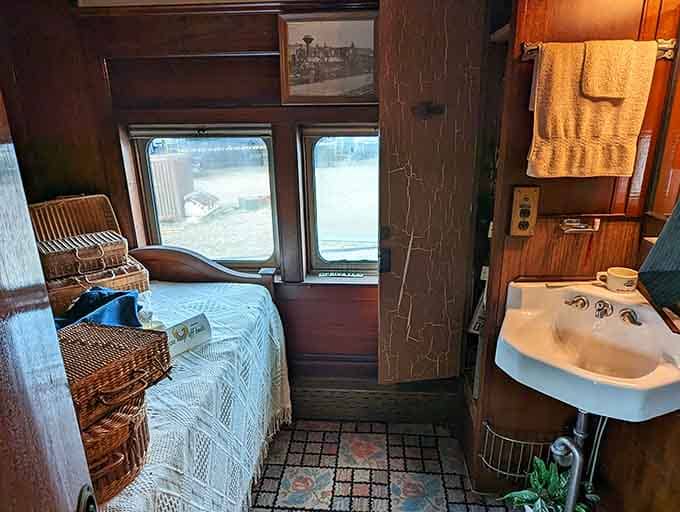 A cozy sleeping compartment with actual beds and a sink, proving luxury once meant privacy and comfort, not just thread count.
