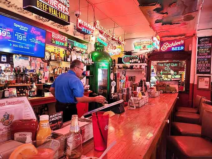 The bar where dreams are poured and burgers are assembled with the precision of a surgical team.