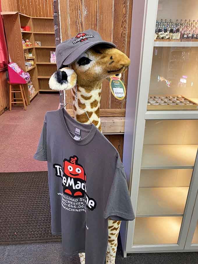 Even the giraffe knows this place is special enough to wear the merchandise with pride and style.