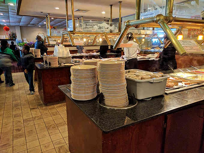 The buffet line stretches on like a delicious promise, with fresh options waiting under those warming lights patiently.