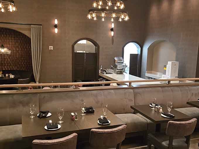 Booth seating with a view of faux cliffs beats your usual Tuesday night dining backdrop.