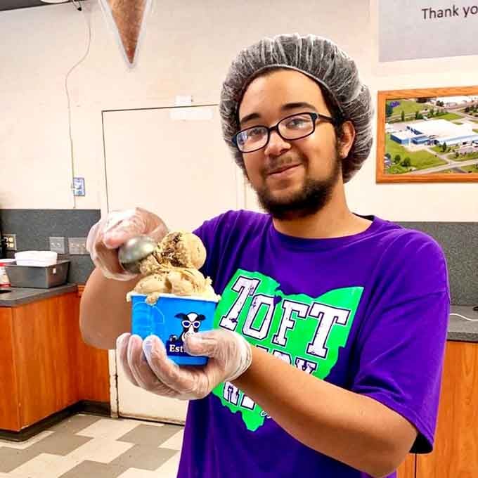 Staff members prepare orders with practiced efficiency, scooping happiness one enormous cone at a time for eager customers.