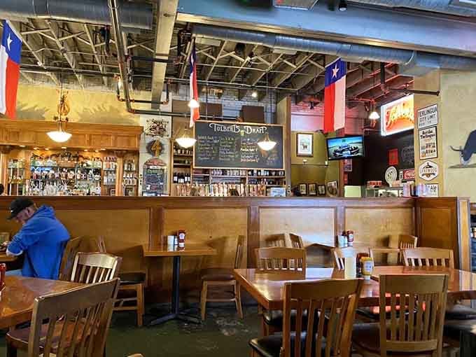 The bar area features Texas flags and plenty of taps, because sometimes chili needs a cold beer companion.