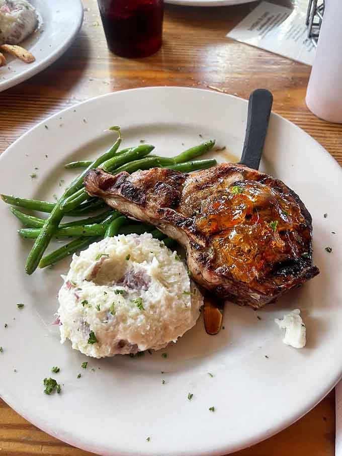 Pork chop with mashed potatoes and green beans &ndash; comfort food that earned its beach vacation too.